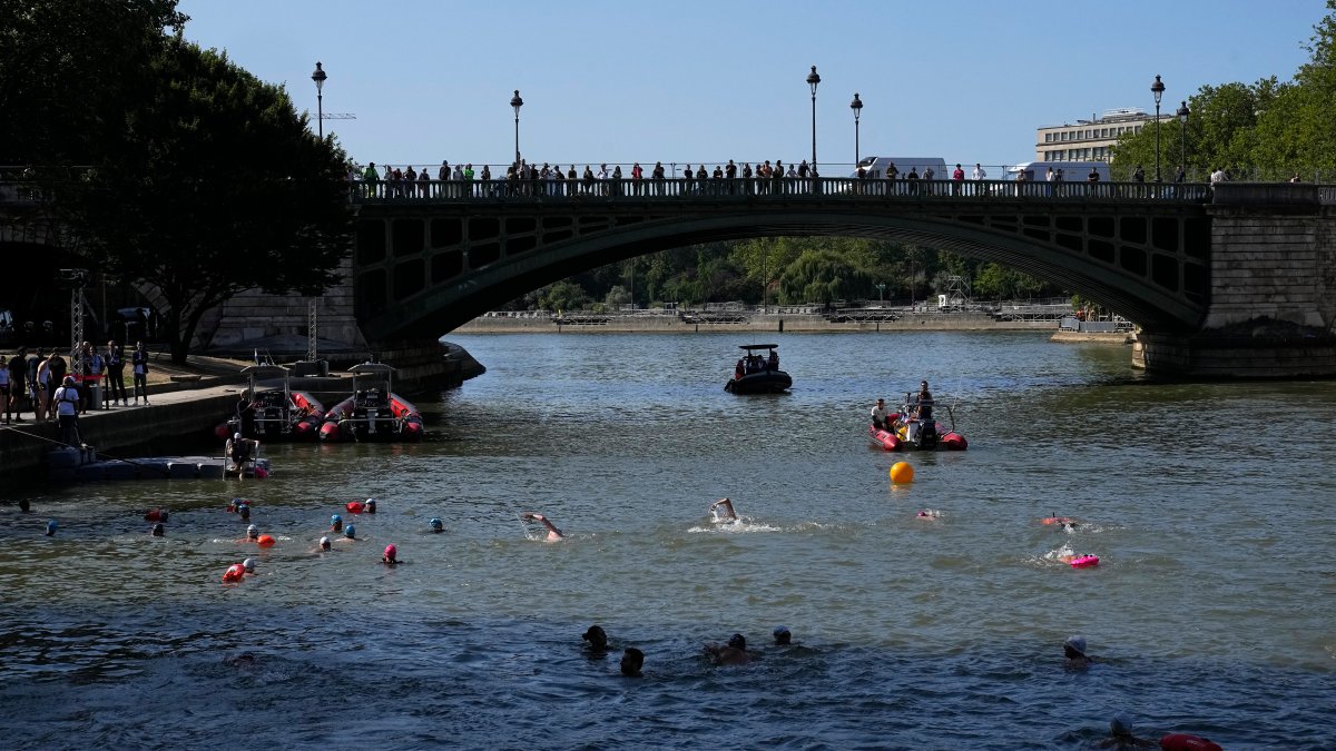 German Olympic swimmers fall ill after swimming in Paris’ Seine River ...