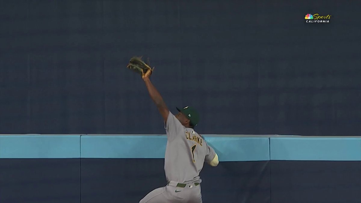 Denzel Clarke robs homer with wild wall-scaling catch vs. Blue Jays ...